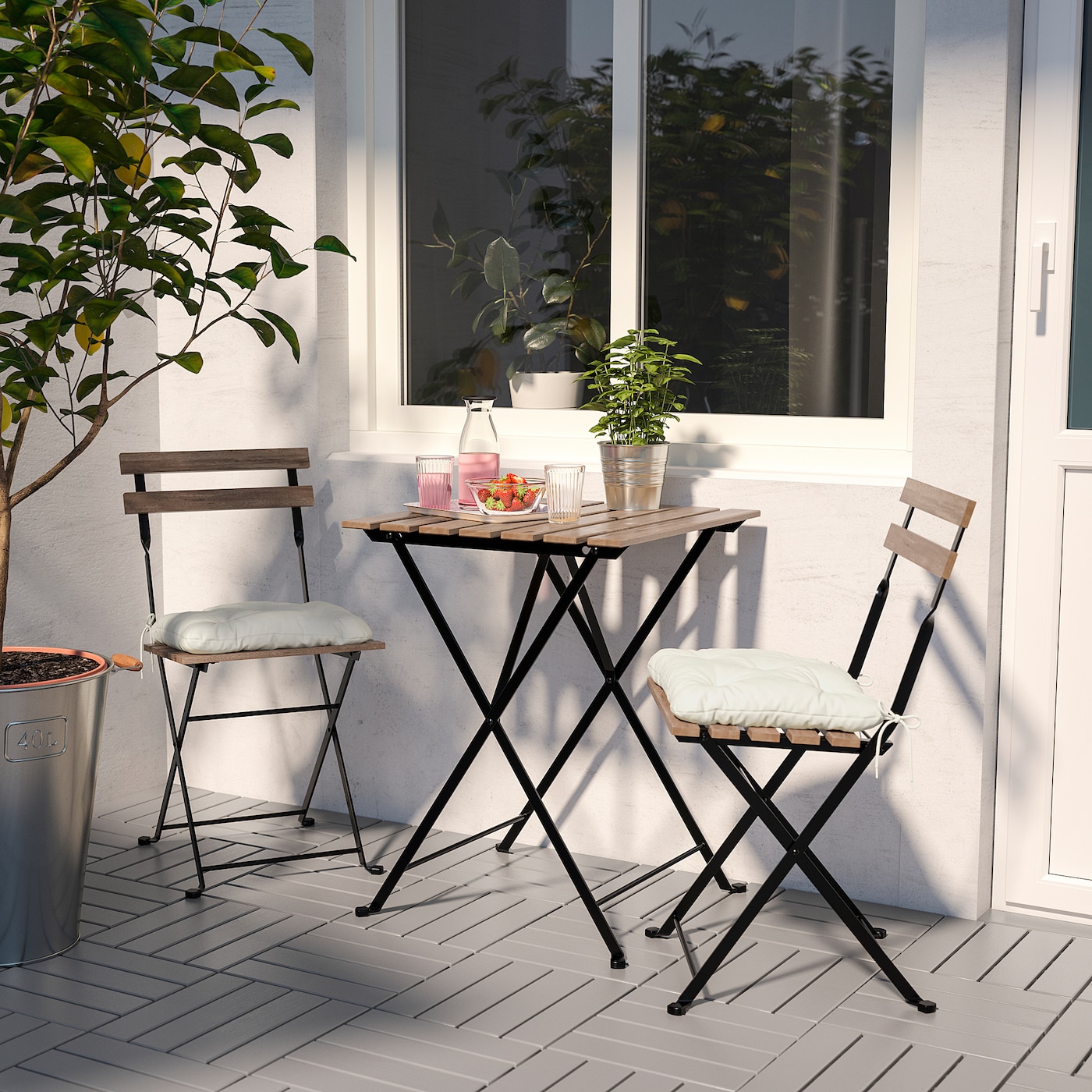 TARNO table 2 chairs outdoor black light brown stained Kuddarna beige IKEA